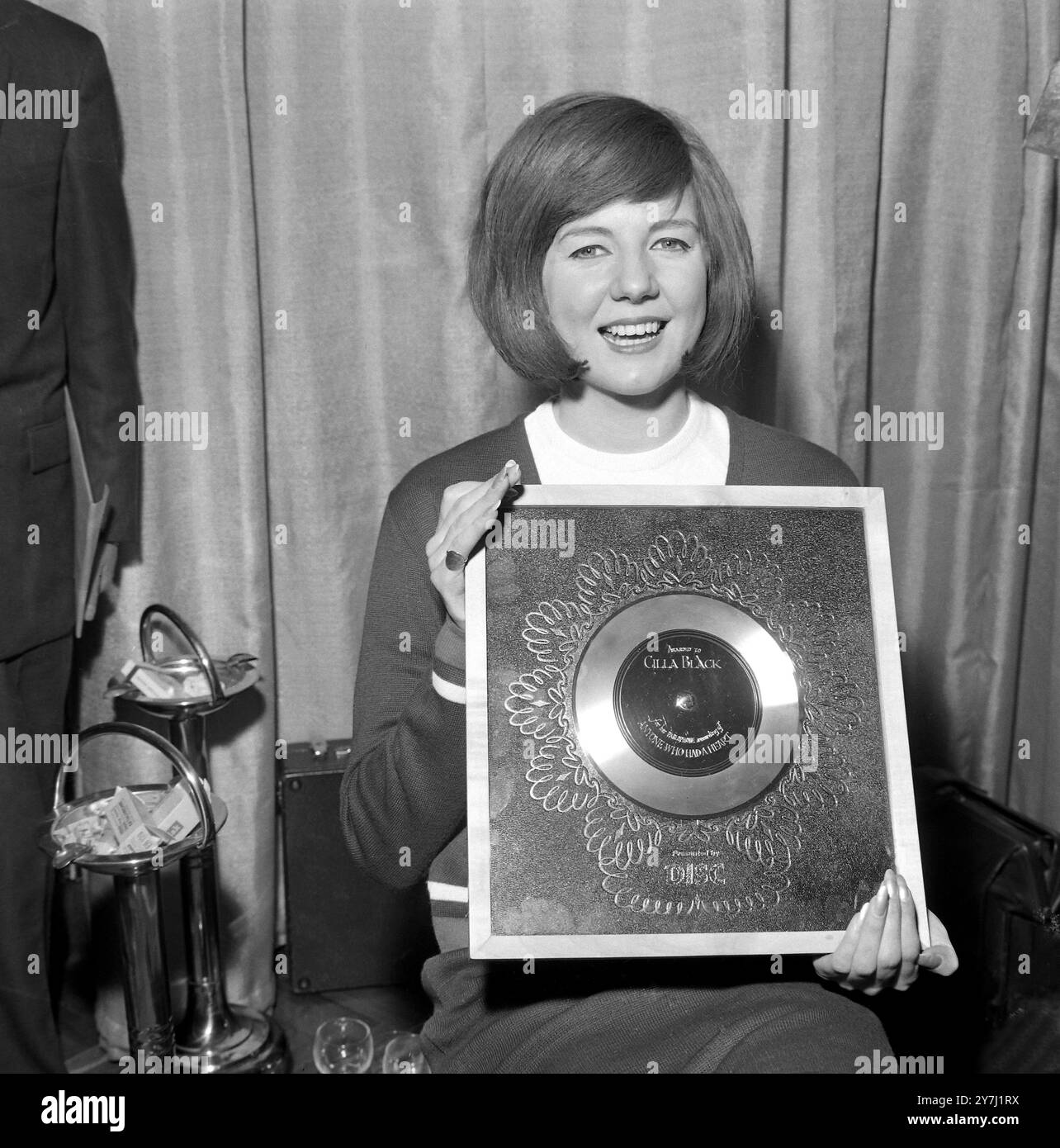 23 MARCH 1964 SINGER CILLA BLACK RECEIVES A SILVER DISC FROM E.M.I. FOR ...