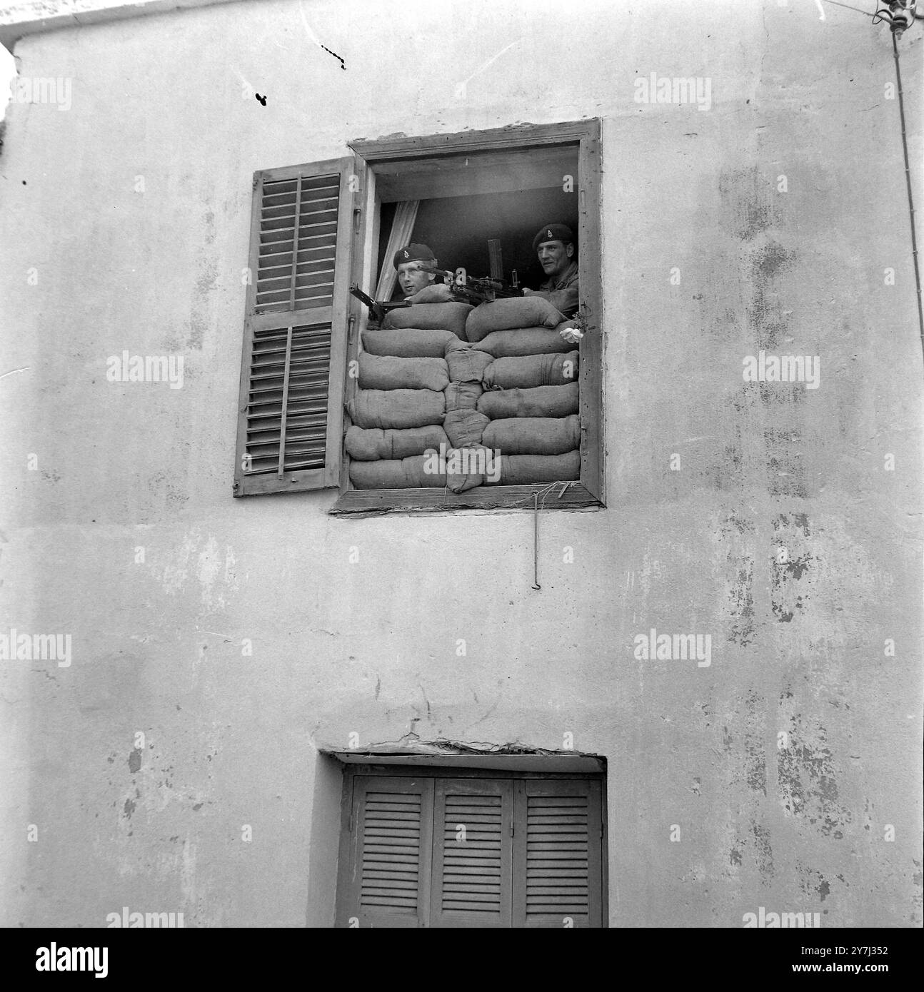 ARMY BRITISH SOLDIERS WATCH FROM A WINDOW IN NICOSIA, CYPRUS ; 13 MARCH ...