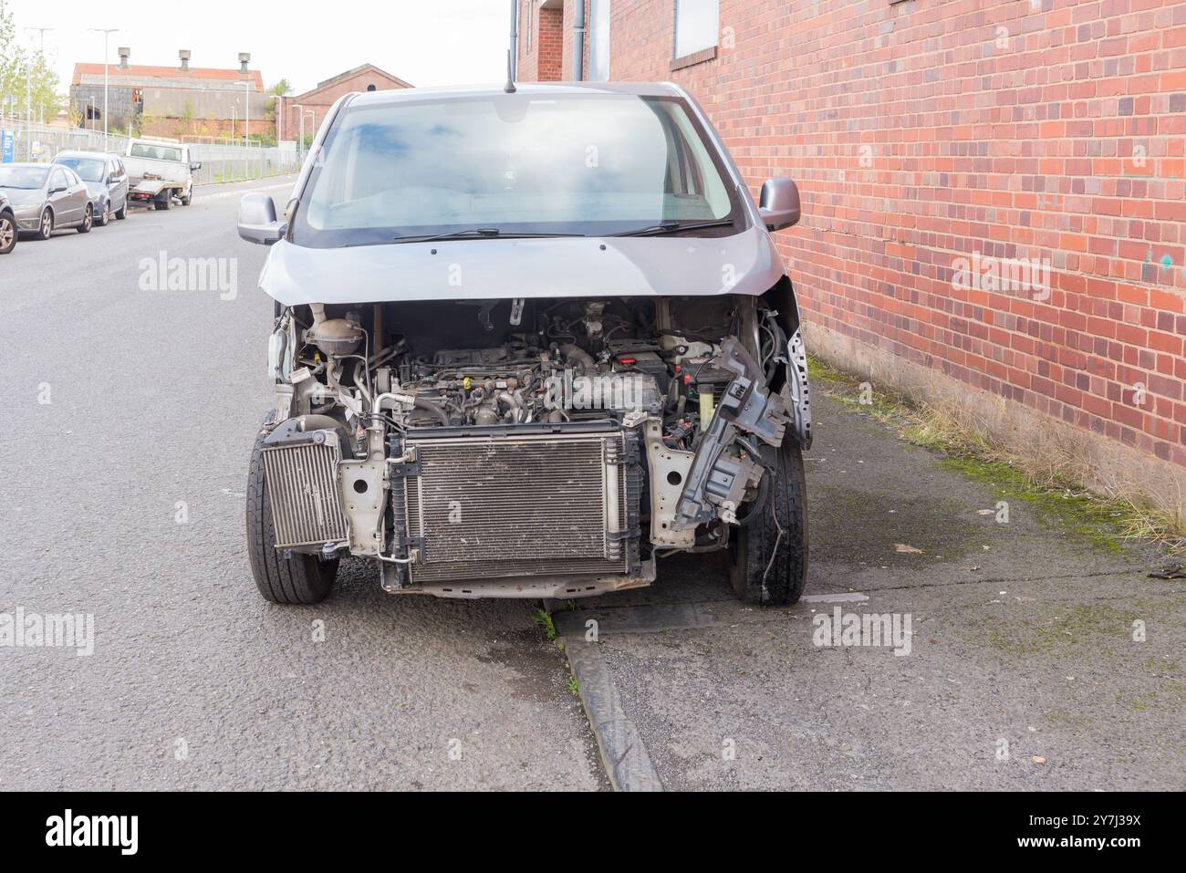 Van parked in the street on the pavement with missing stolen front of ...