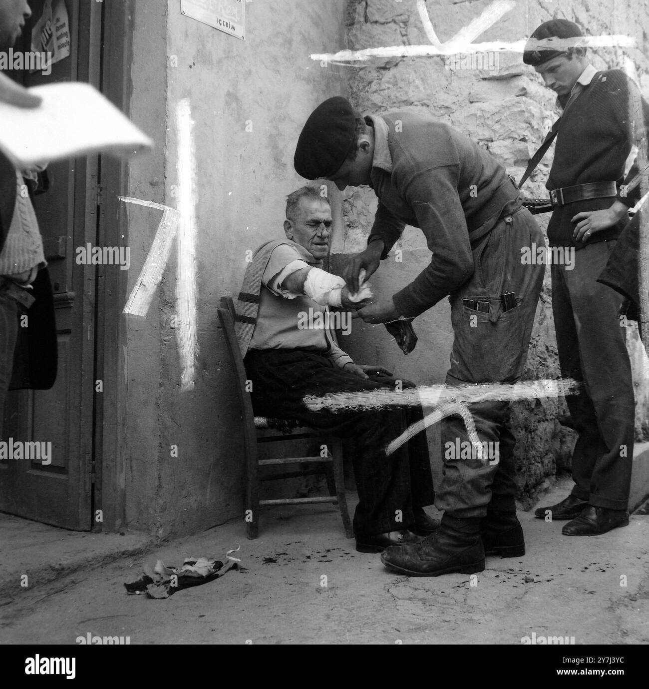 ARMY BRITISH SOLDIER DRESSES THE ARM OF TURKISH CIVILIAN IN MALIA ...