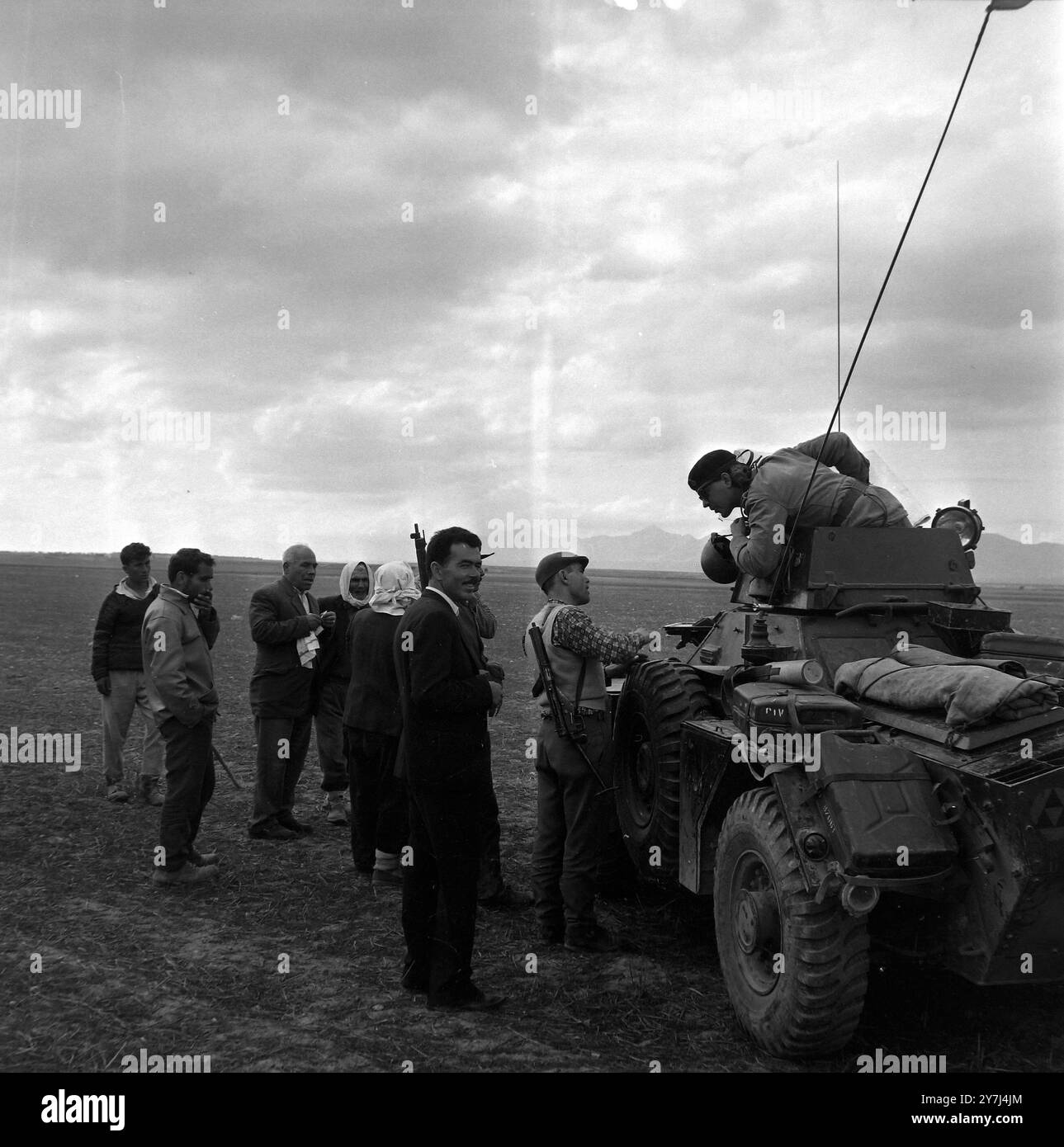 ARMY ARMED VILLAGERS TALK TO CREW OF BRITISH ARMOURED VEHICLE IN ...