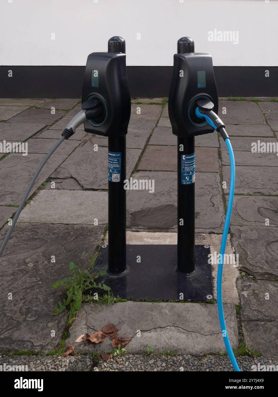 Modern Electric Vehicle Charging Stations on Urban Pavement Stock Photo ...
