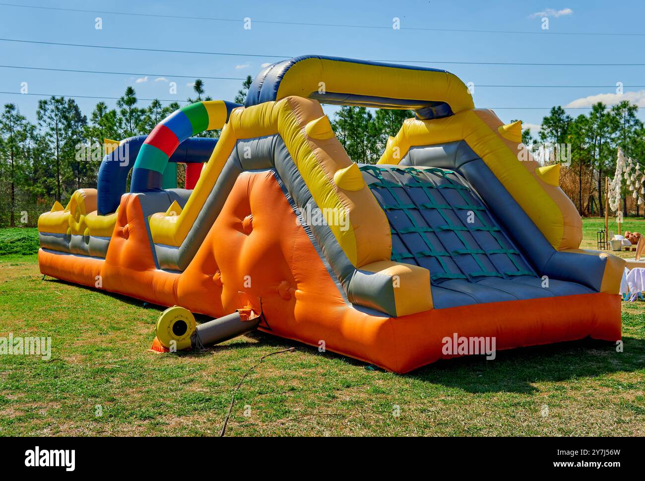 Colorful, large, vibrant inflatable bounce slide for children on the ...