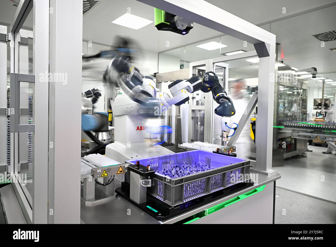 Ravensburg, Germany. 12th Sep, 2024. Two robot arms pick up individual ...