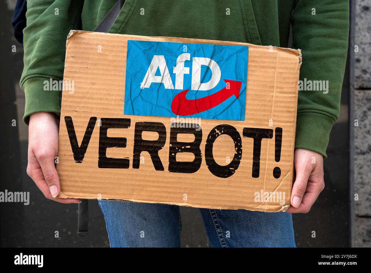 September 30, 2024: A person holds a cardboard sign with the ...