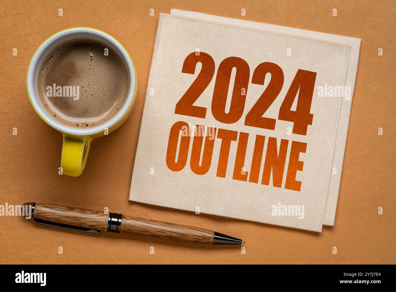 2024 year outline text on a napkin with a cup of coffee, end of year ...