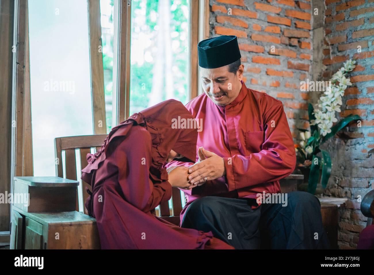 daughter shaking hands with father is a tradition of forgiveness Stock ...