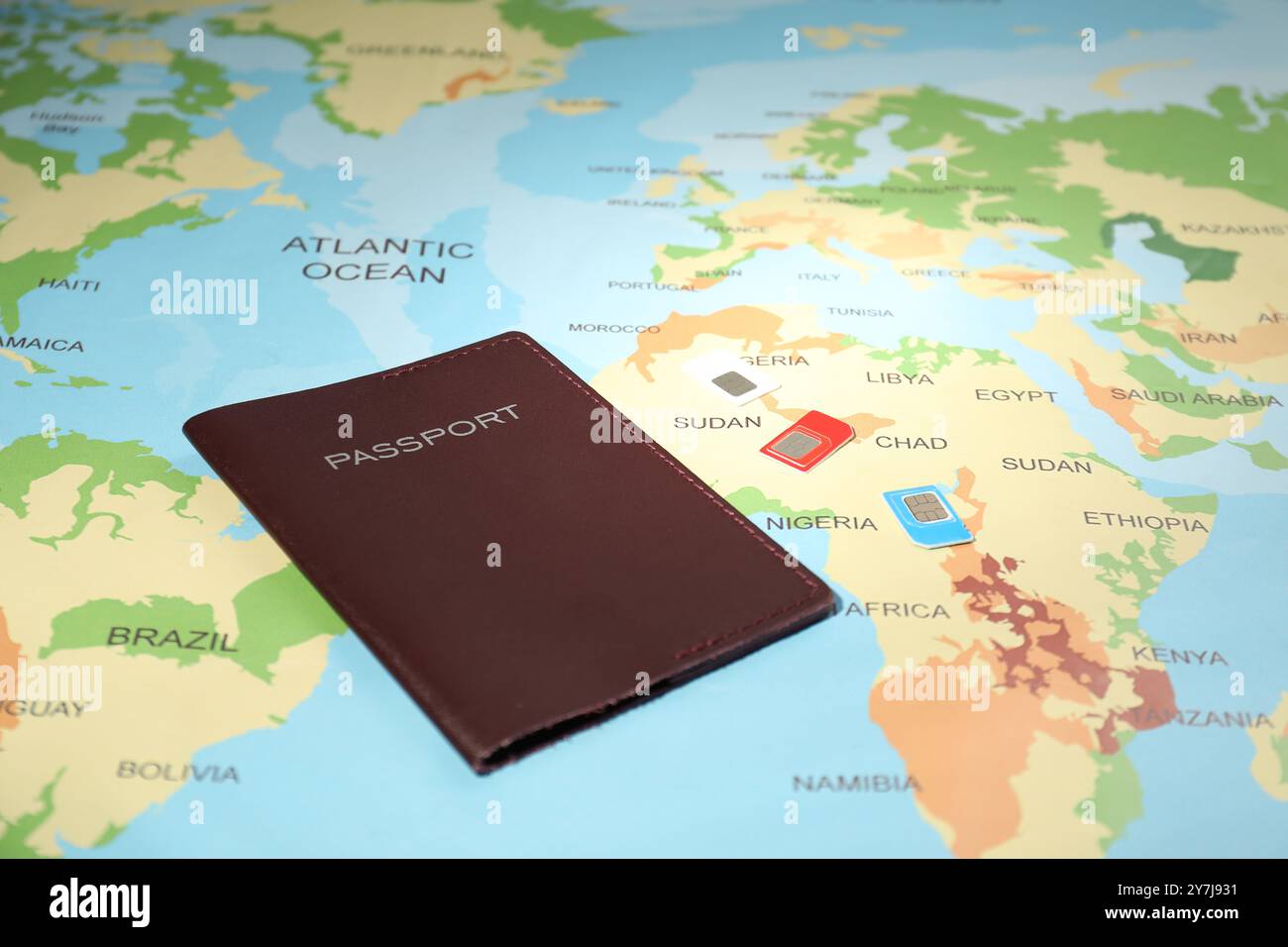 Modern SIM cards and passport on world map Stock Photo - Alamy