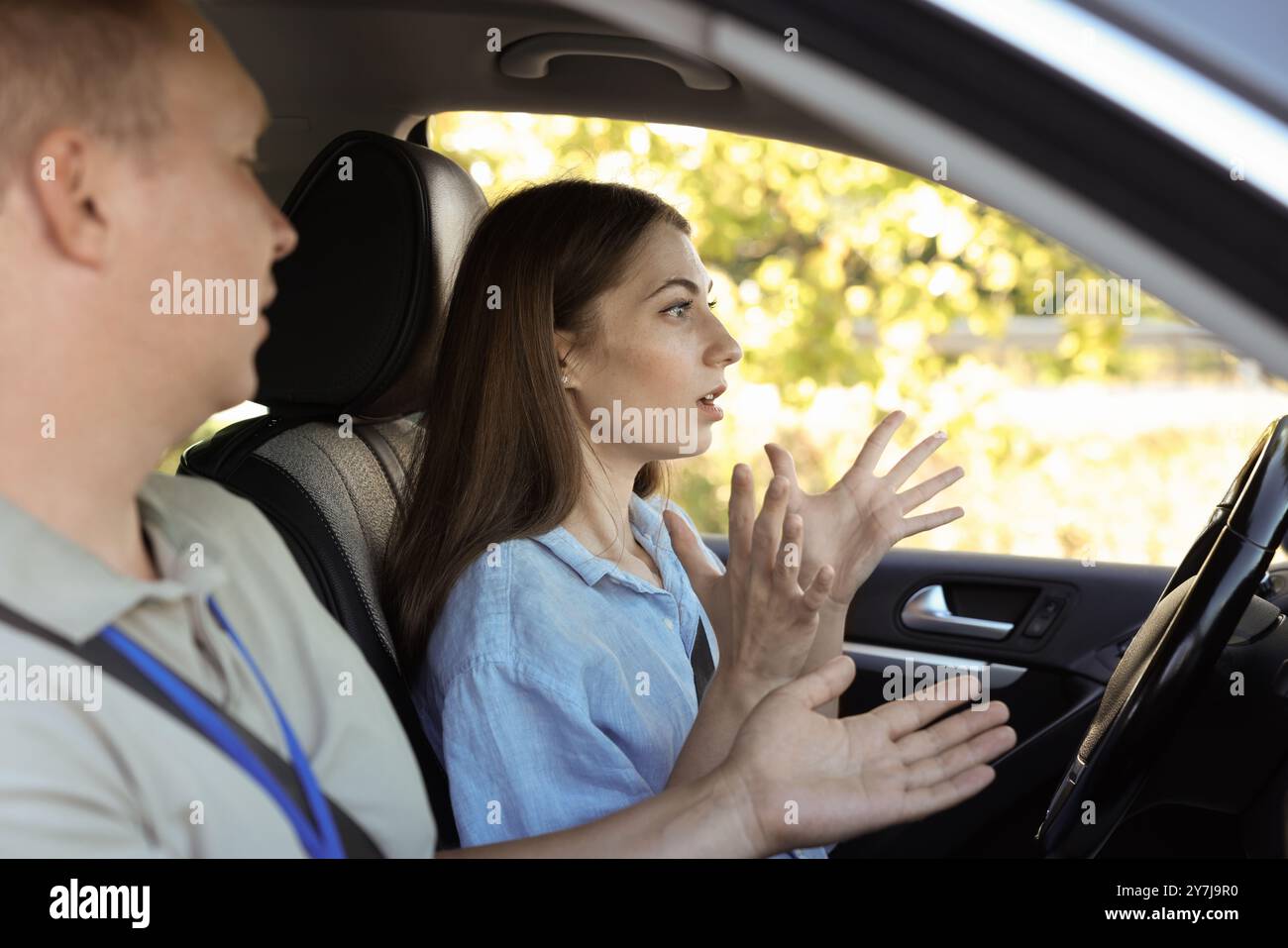 Driving school. Emotional woman having driving lesson Stock Photo - Alamy