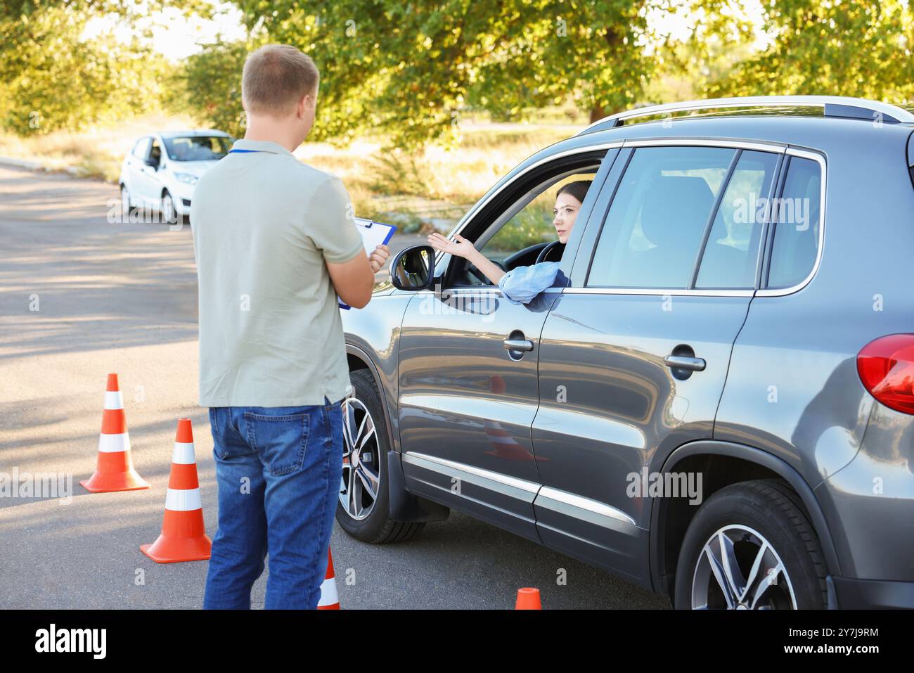 Woman passing maneuverability driving test on track Stock Photo - Alamy