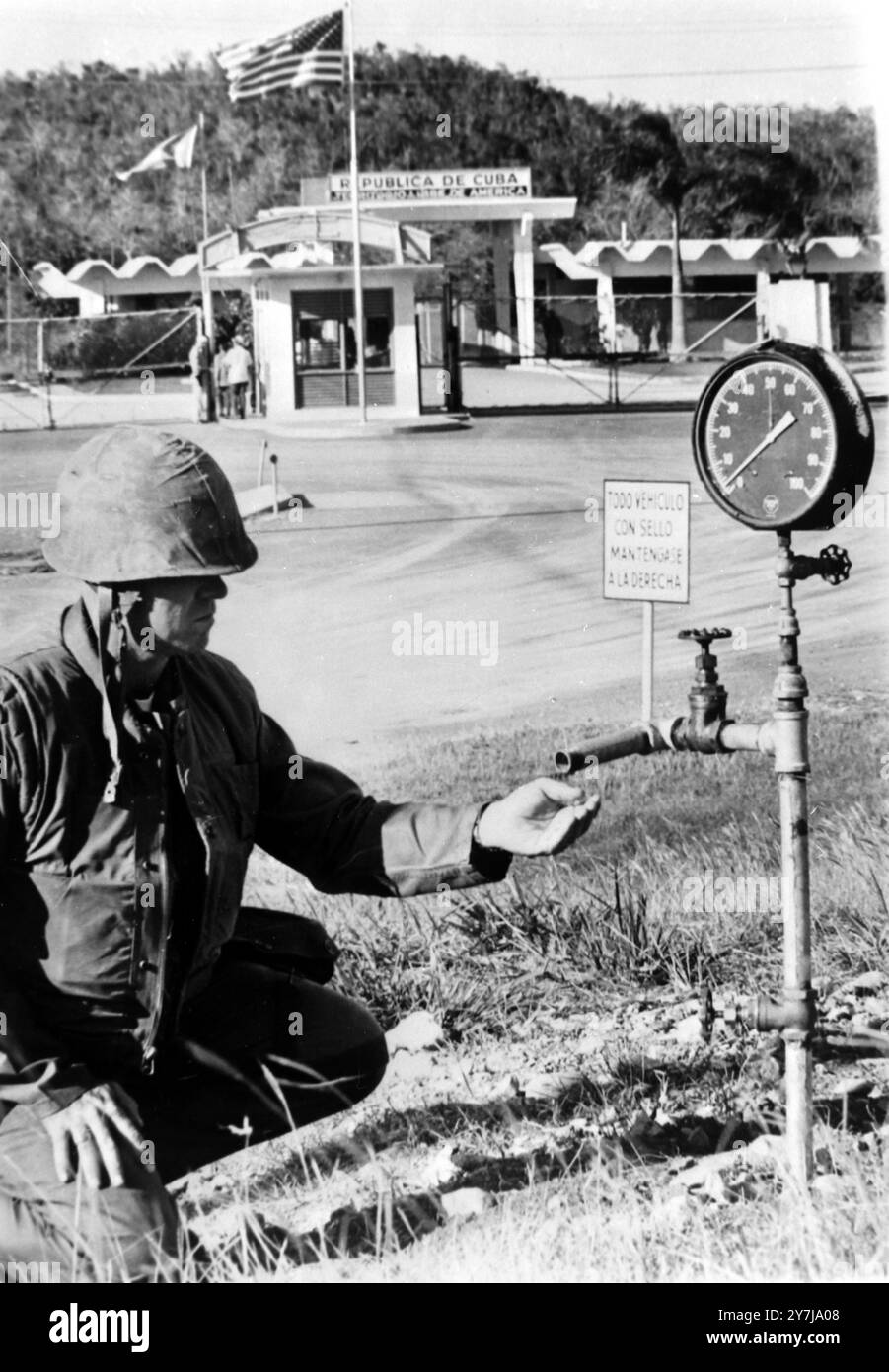 18 FEBRUARY 1964 CAPTAIN PATRICK COLLINS OF THE US MARINES CHECKS THE ...
