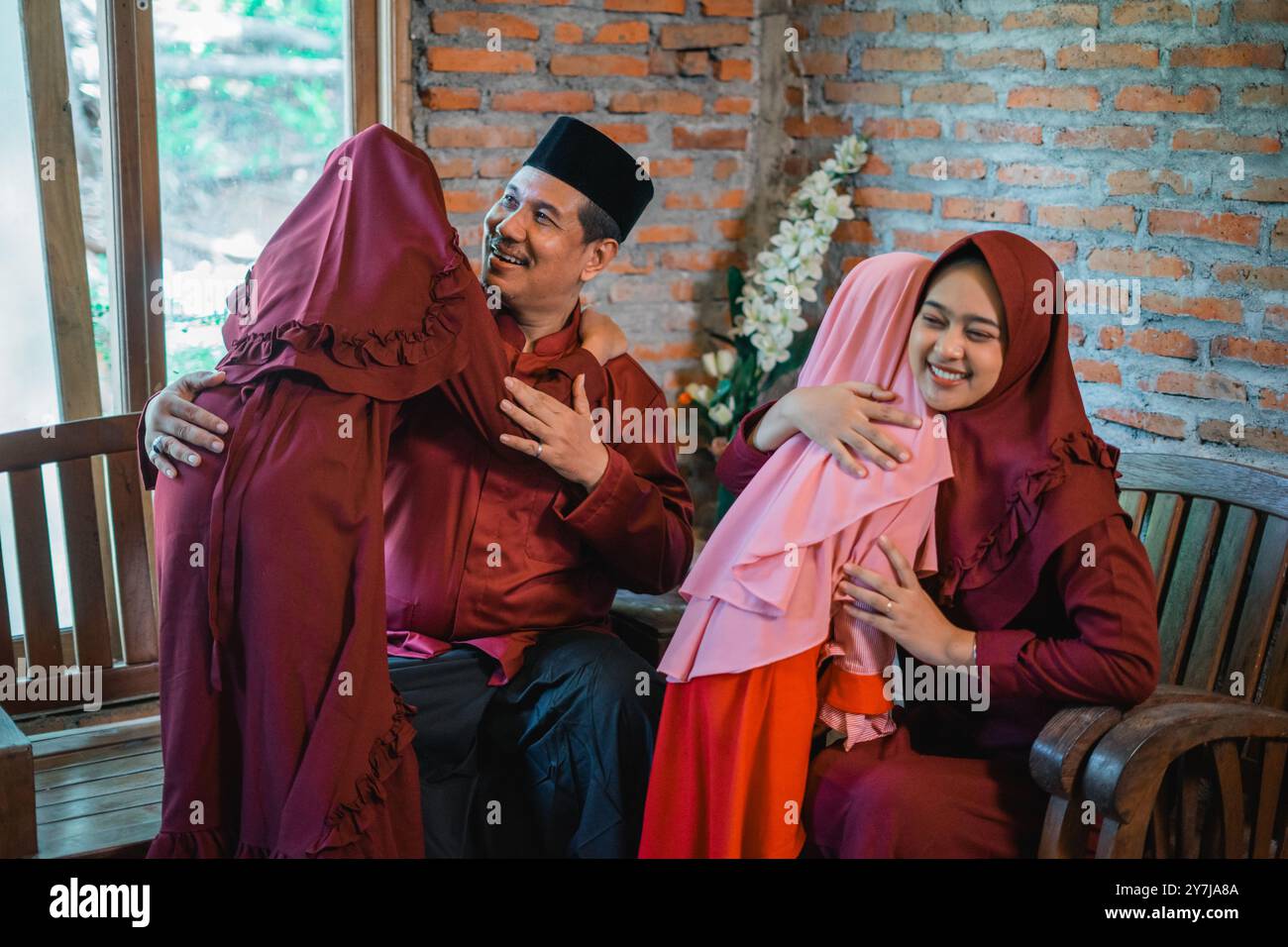 Muslim family embracing during hi-res stock photography and images - Alamy