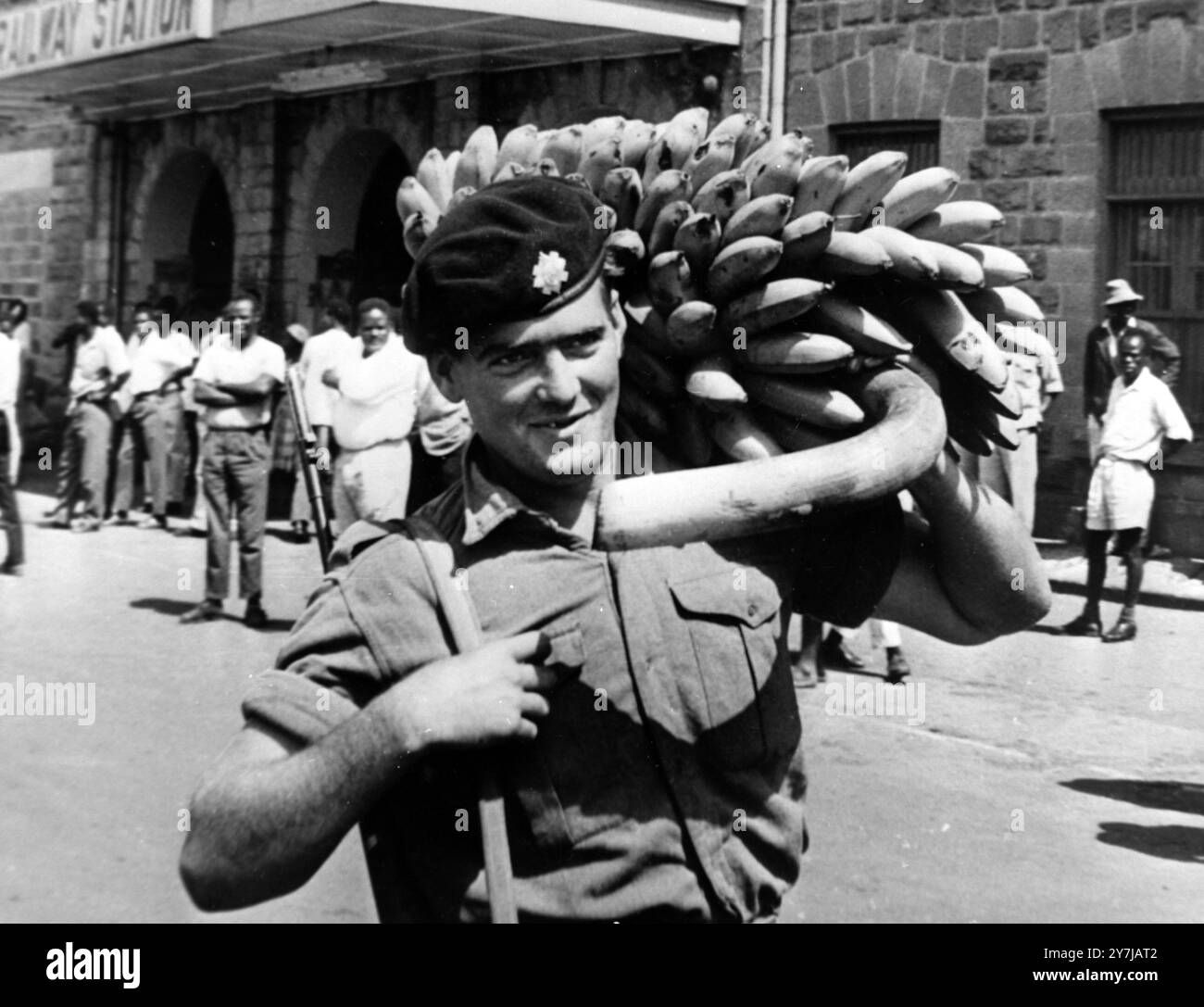BRITISH ARMY SOLDIER WITH BANANA BUNCH OVER HIS SHOULDER IN NAIROBI ...