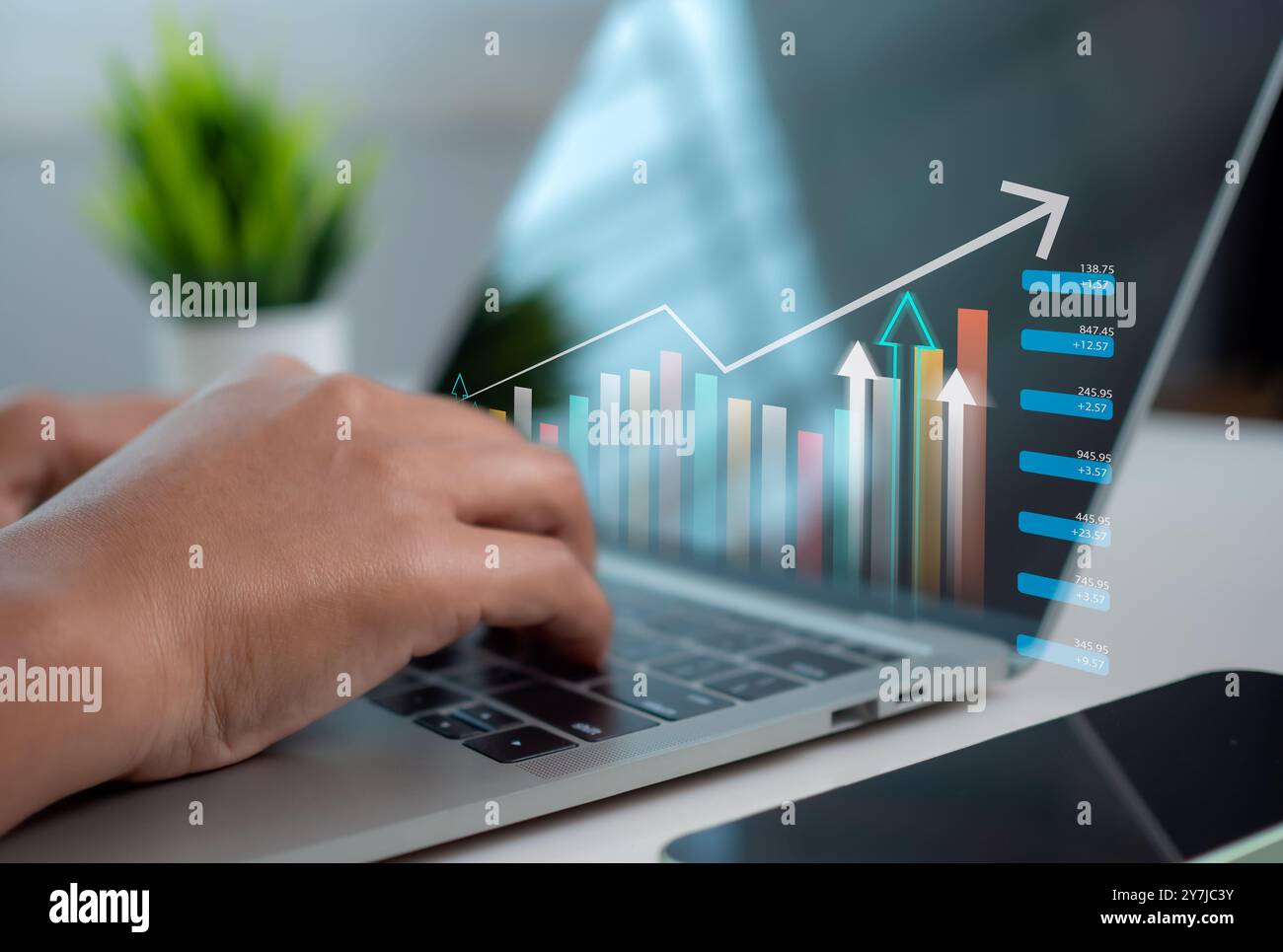 Businessman is showing a growing virtual hologram of analytics ...