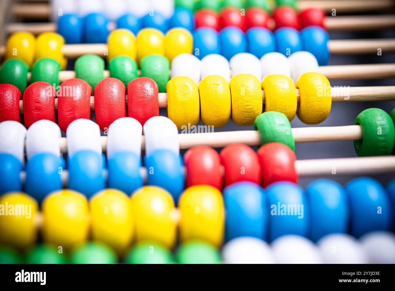 A colorful abacus displaying vibrant beads, perfect for educational ...