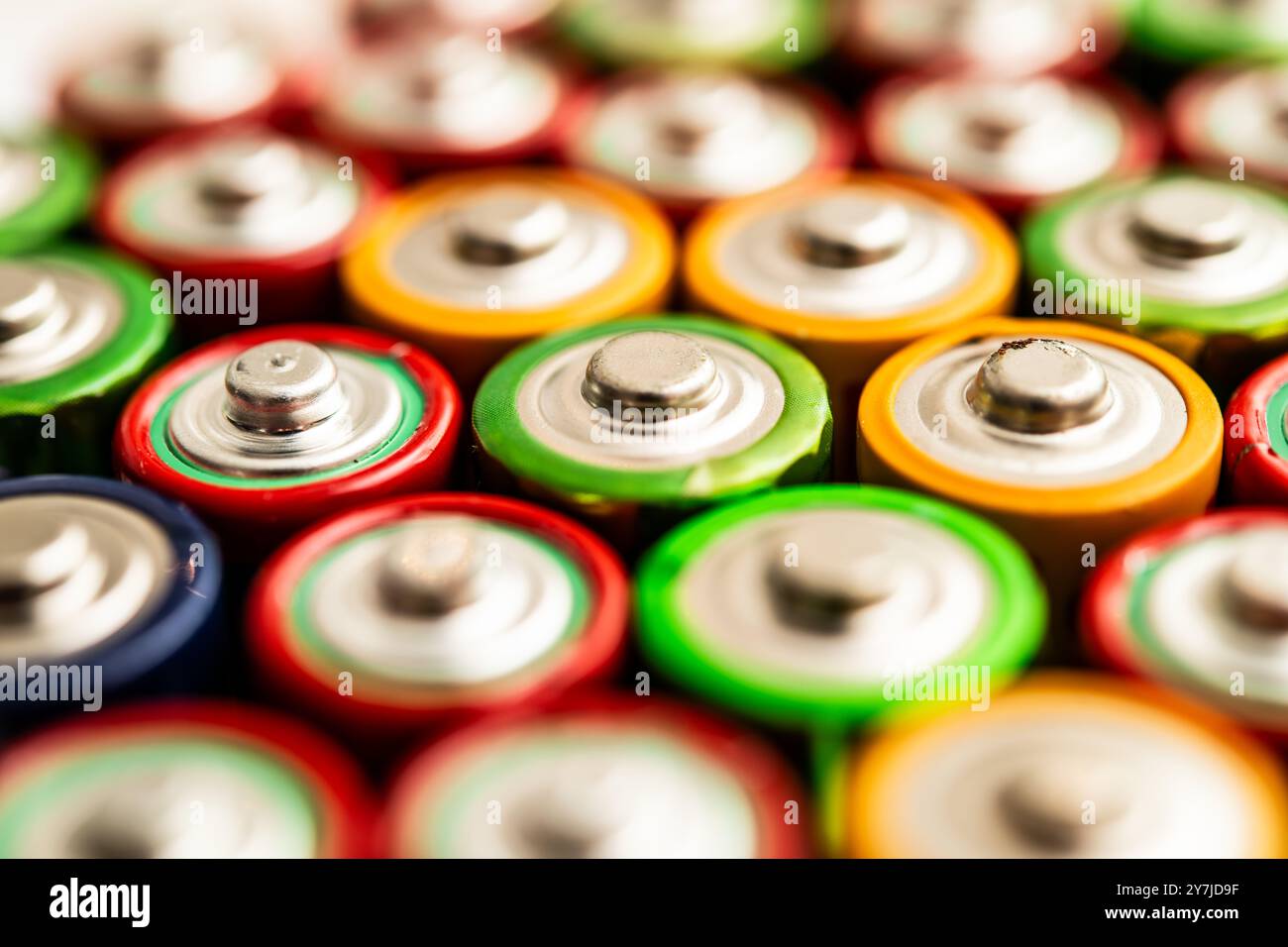 Colorful batteries stacked together, representing renewable energy, eco ... Colorful batteries stacked together, representing renewable energy, eco ...