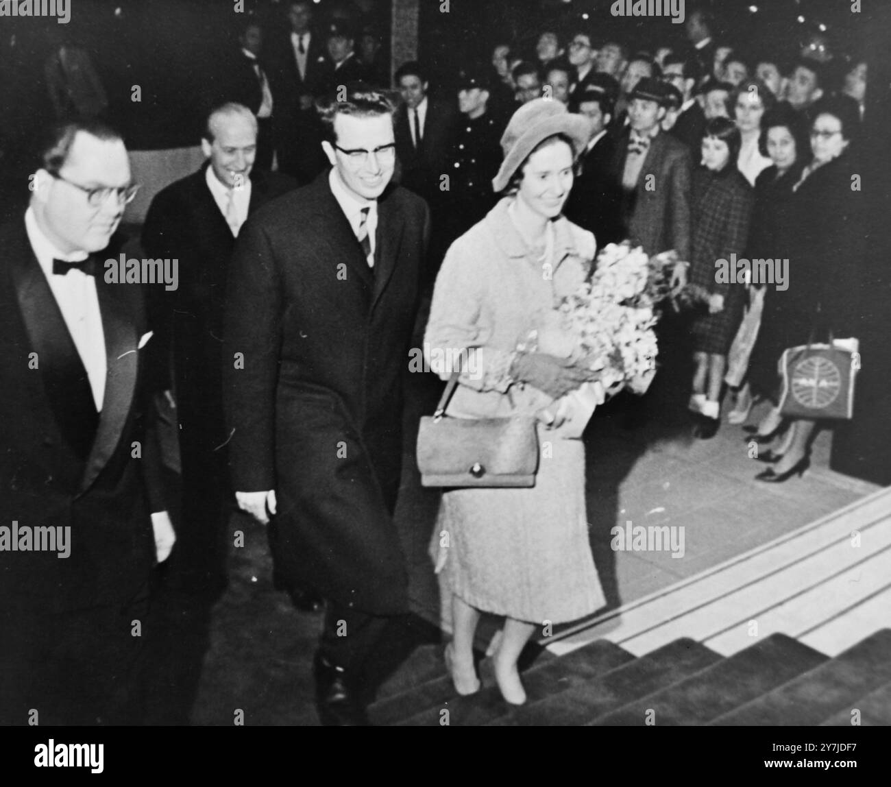 QUEEN FABIOLA AND KING BAUDOUIN ESCORTED THROUGH HOTEL LOBBY IN HONG ...