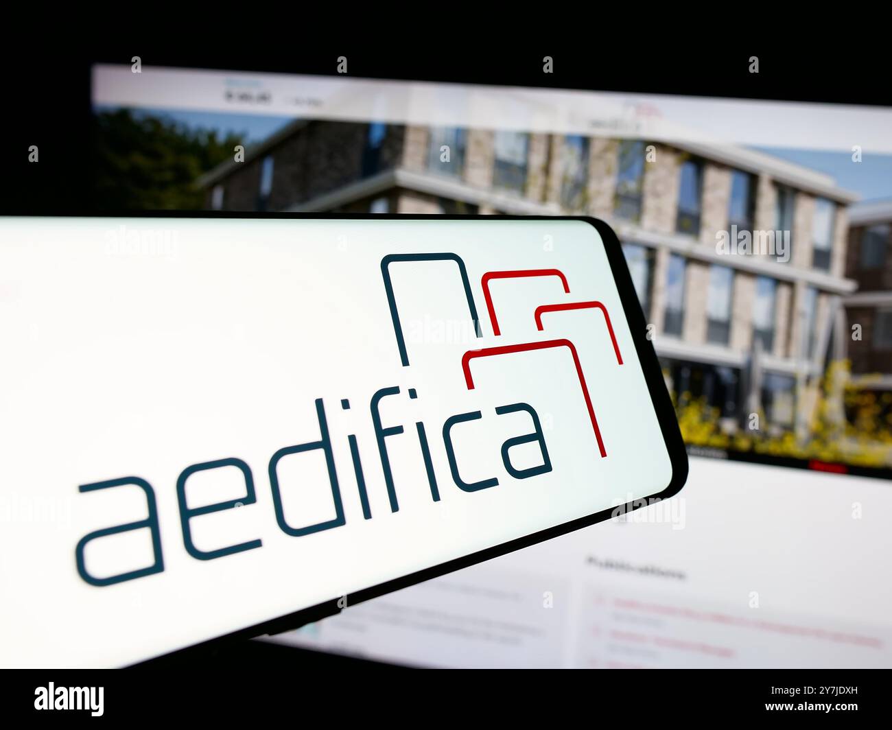 Smartphone with logo of Belgian real estate company Aedifica SA on ...