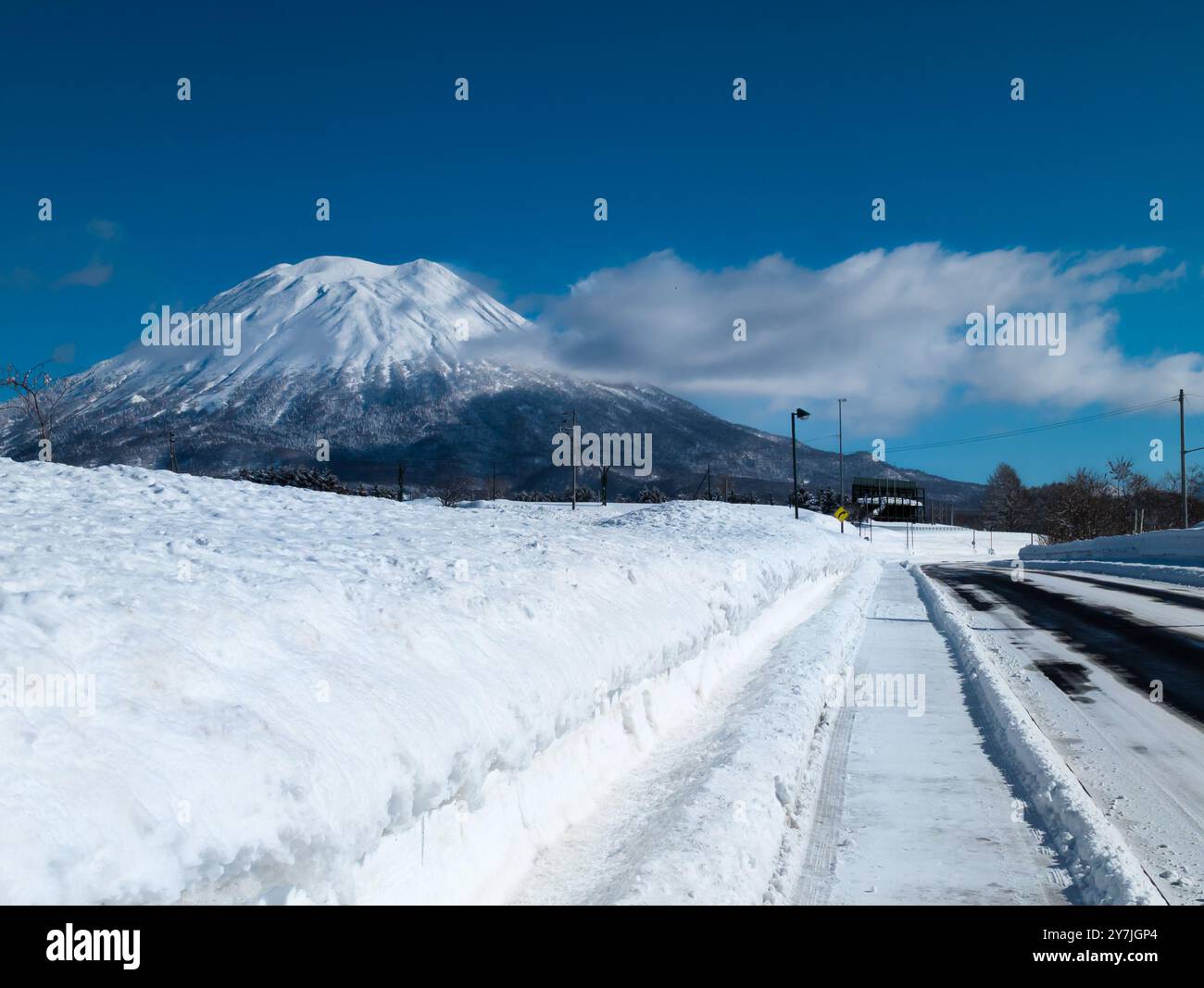 Mount Yotei and snowy streets of Niseko, Hokkaido, Japan Stock Photo ...