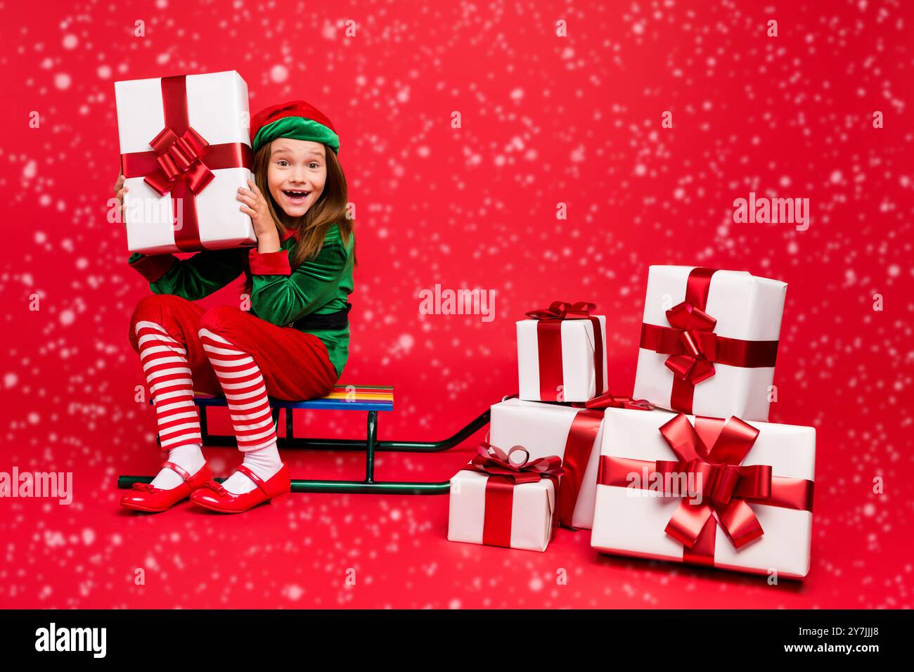 Nice attractive cheerful cheery glad excited funny pre-teen elf sitting ...