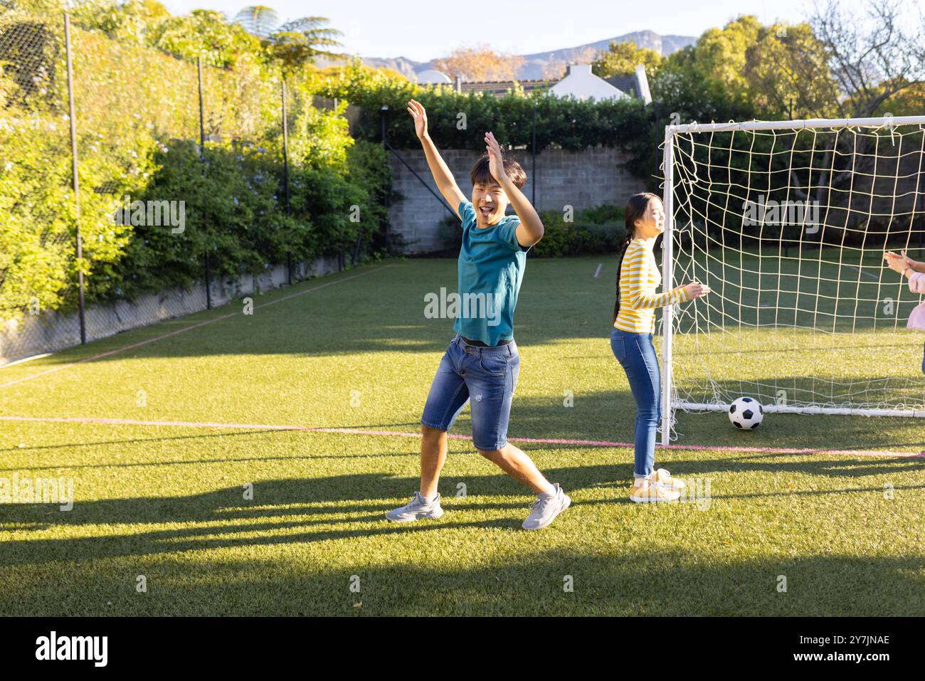 Boy celebrating on soccer field hi-res stock photography and images - Alamy