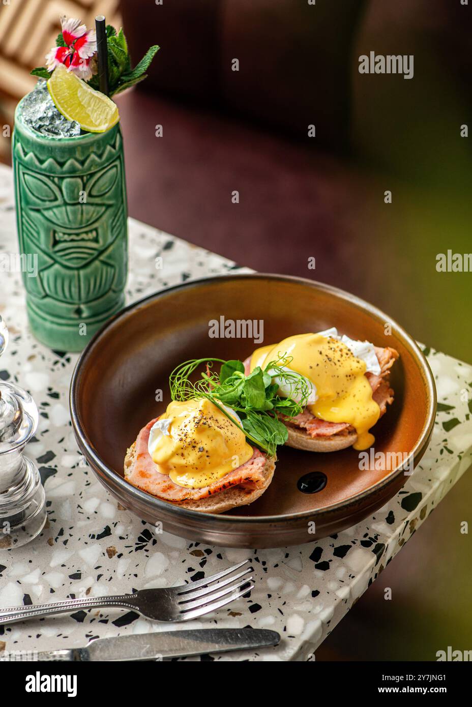 Poached eggs and ham toast with salad on top Stock Photo - Alamy