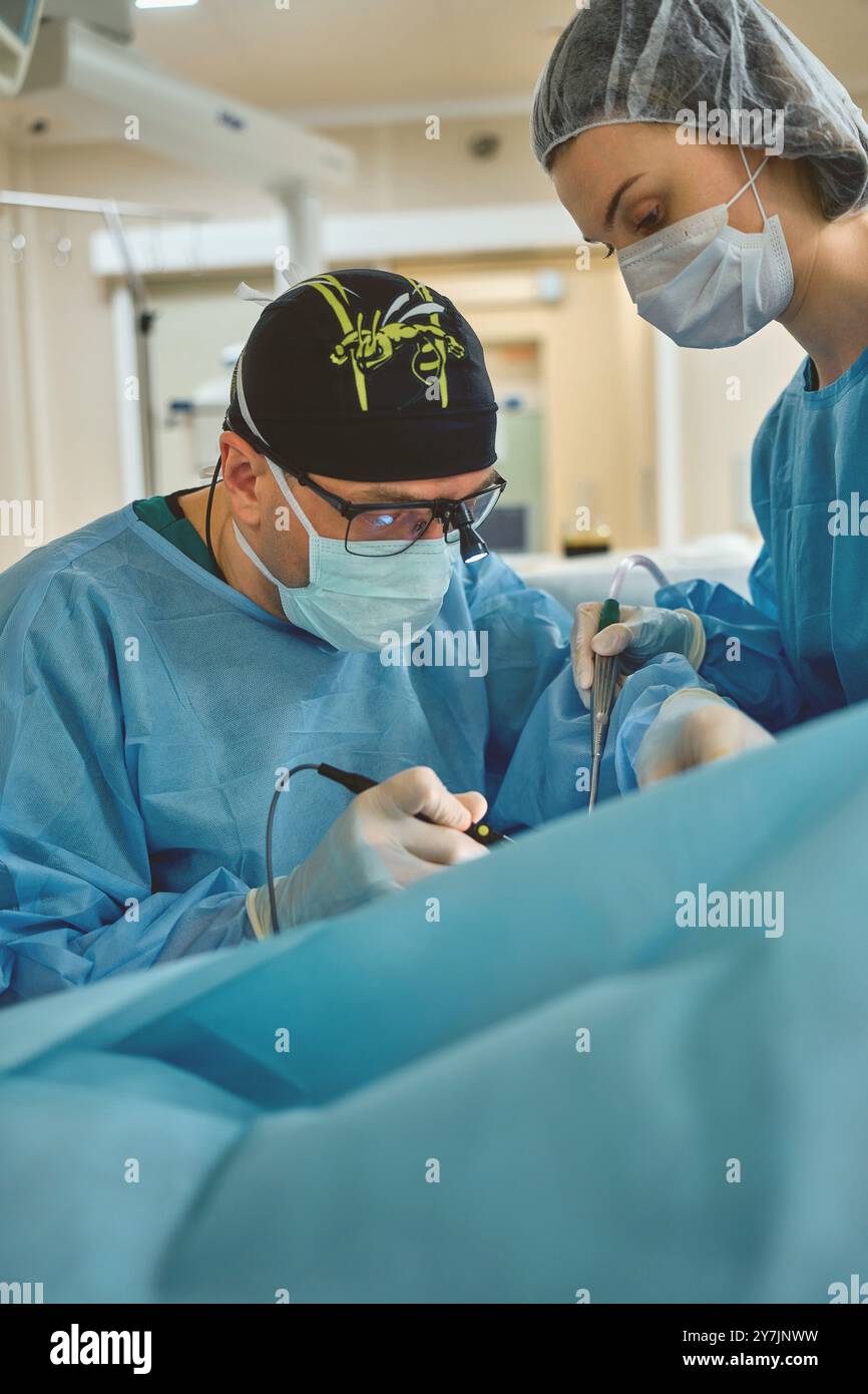 surgeon operates on the patient in the operating room Stock Photo - Alamy