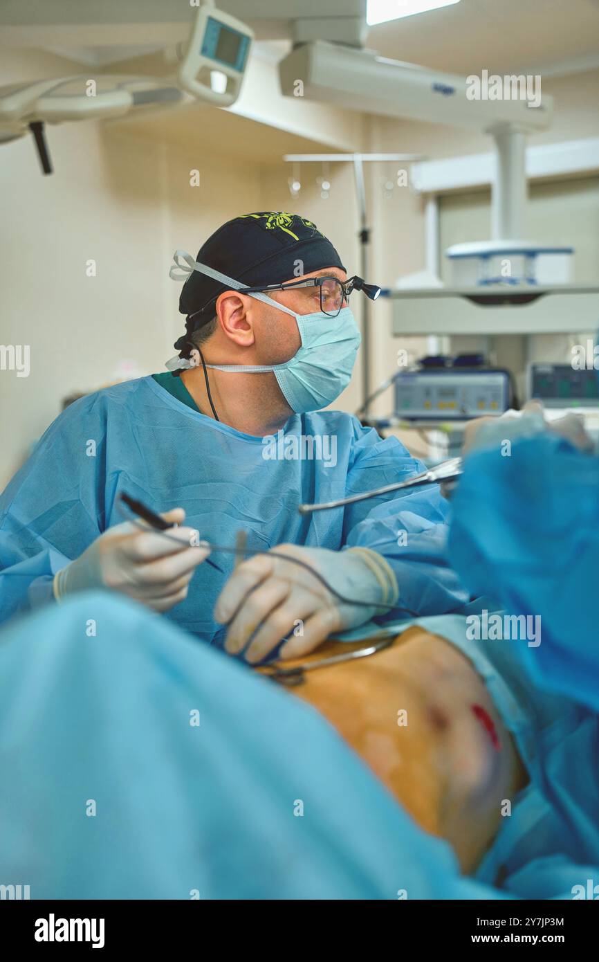 surgeon operates on the patient in the operating room Stock Photo - Alamy