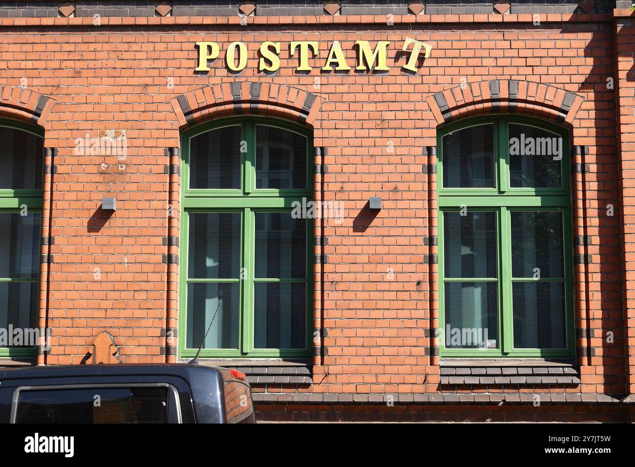Facade made of bricks with the lettering Post Office in Plau am See ...