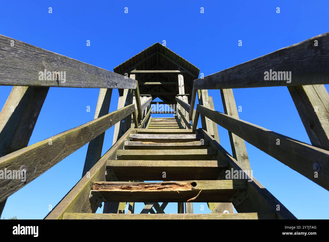 View through a wooden staircase from bottom to top Stock Photo - Alamy