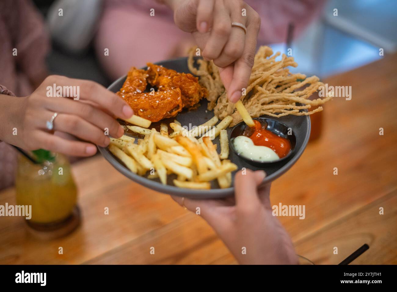 Delicious Sharing Plate with Fries and Chicken on a Casual Dining Table ...