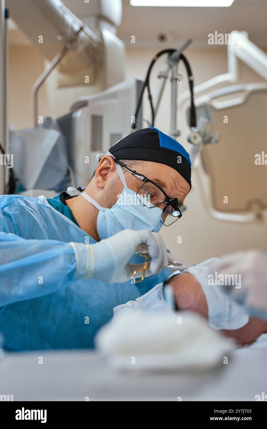 surgeon operates on the patient in the operating room Stock Photo - Alamy