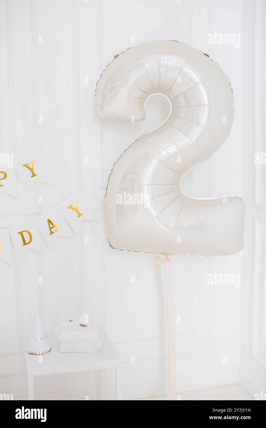 Elegant birthday decoration with number two balloon Stock Photo - Alamy