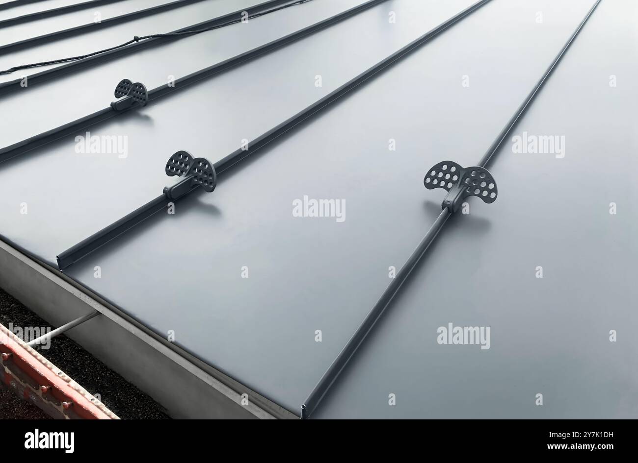 Close-up house retro roof panel with standing seam and fasteners ...