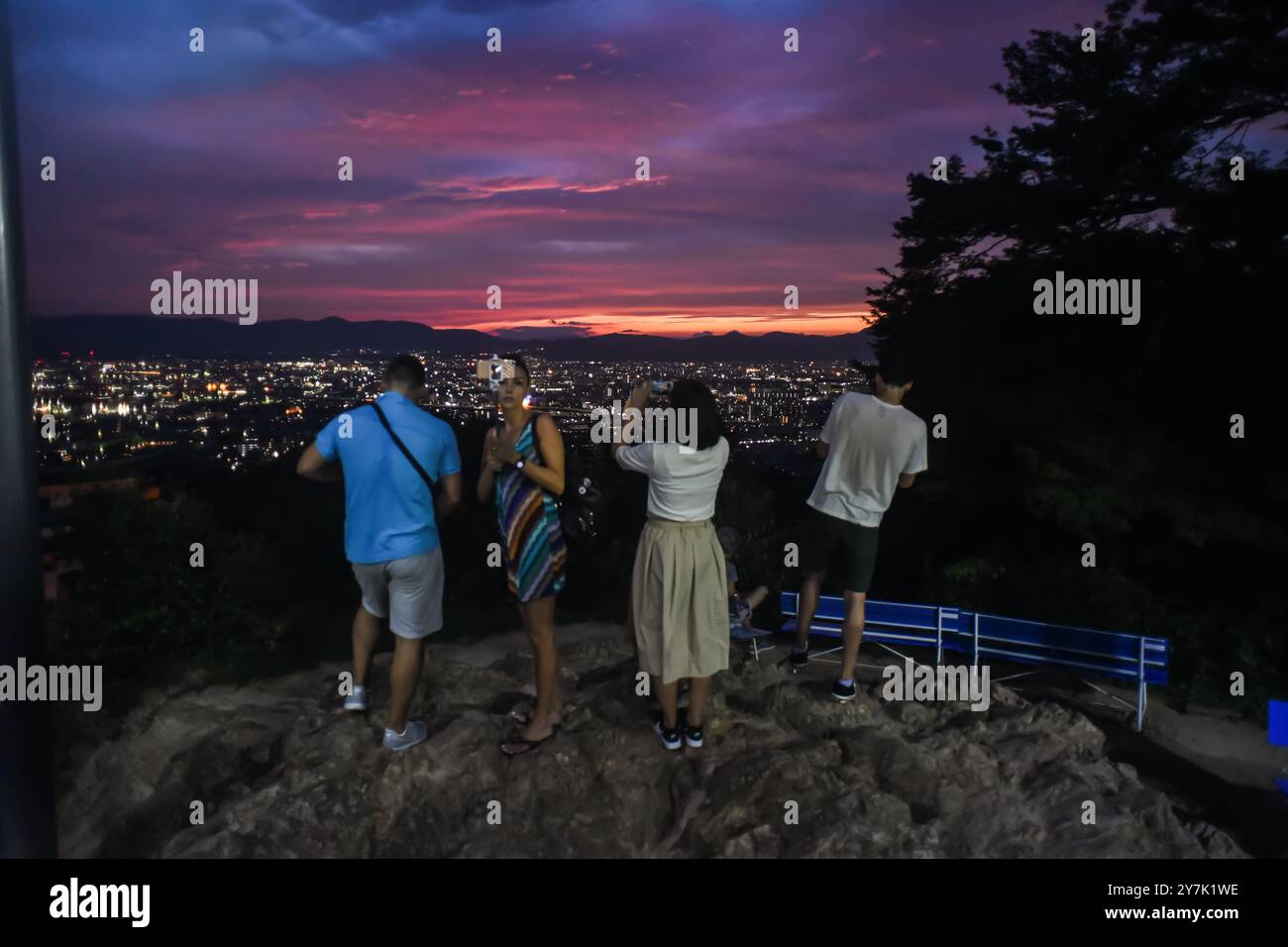 People enjoy the night views of Kyoto from viewpoint at Fushimi Inari Taisha temple, Kyoto ...
