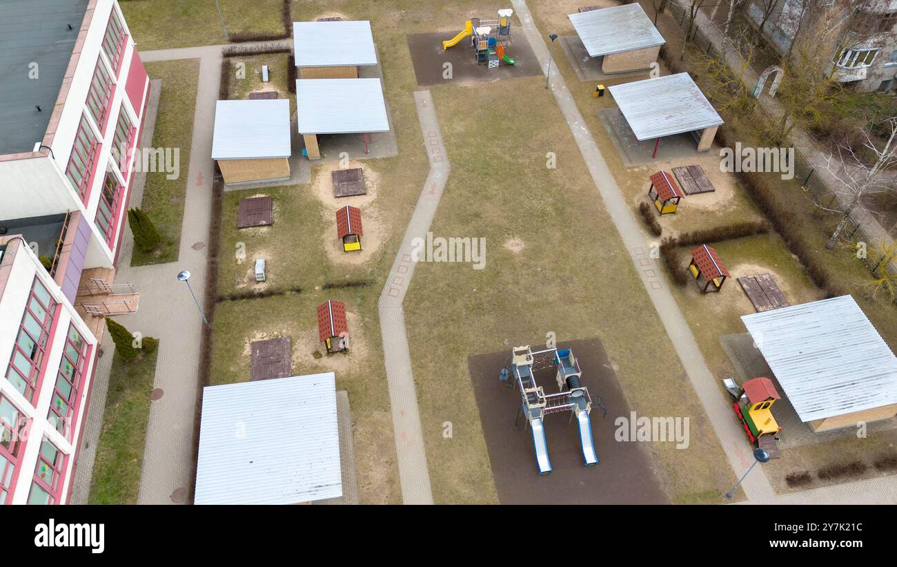 Aerial view of a kindergarten playground with various play structures ...