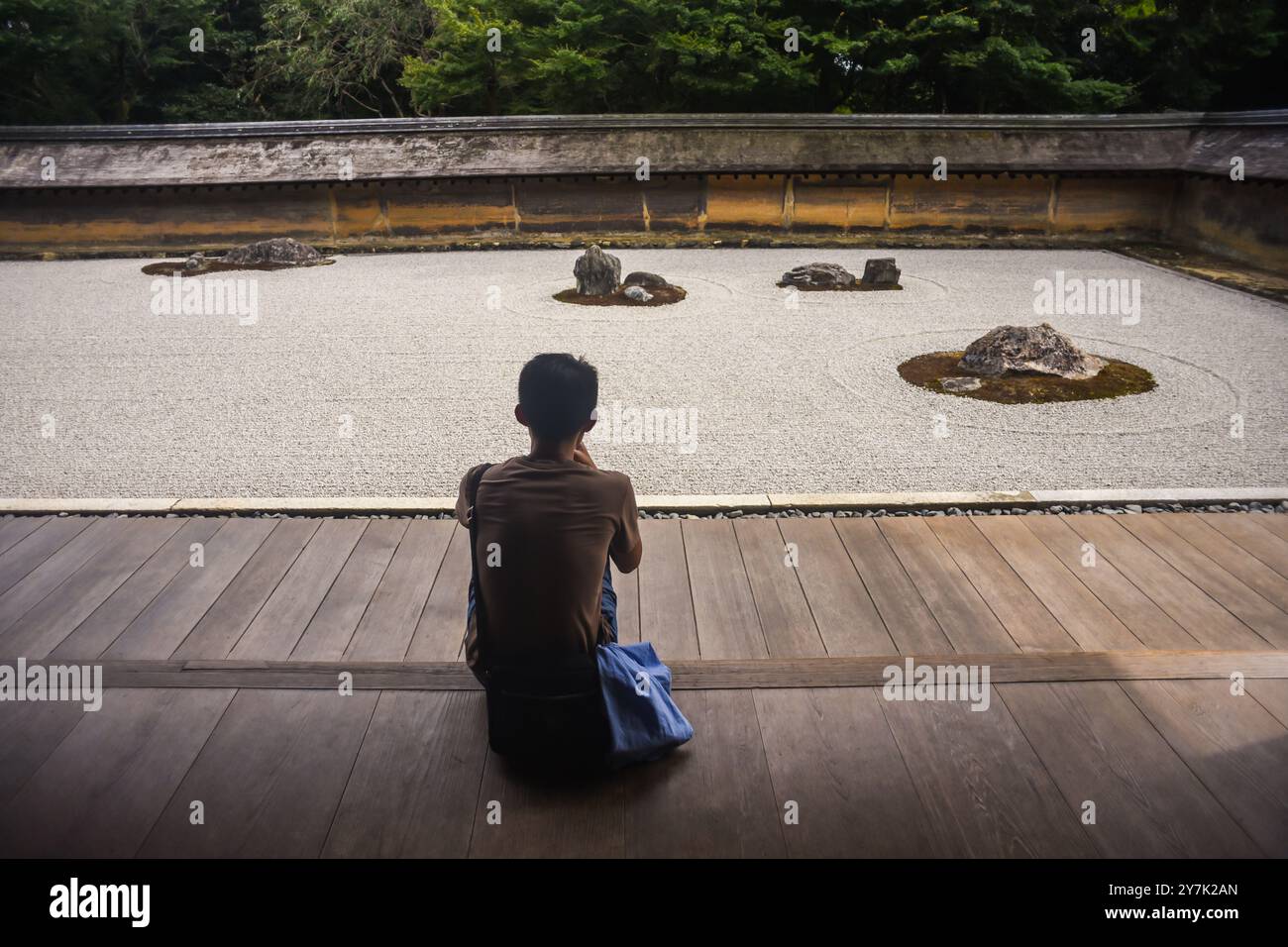 One man meditates at Japanese zen garden, Ryoan-Ji Temple in Kyoto ...