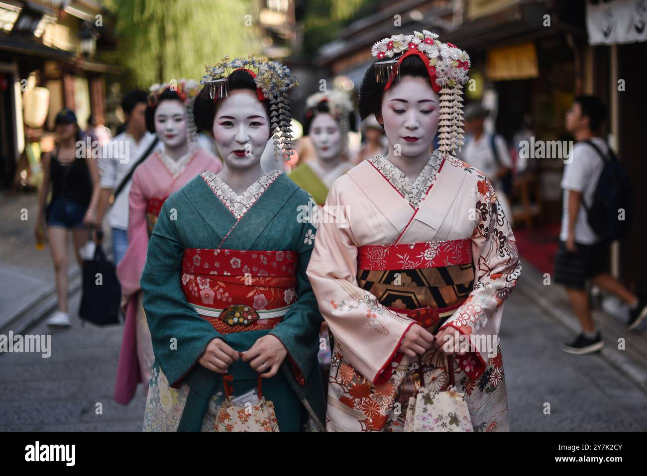 Group of women dressed as Maikos in the streets of Kyoto, Japan Stock ...