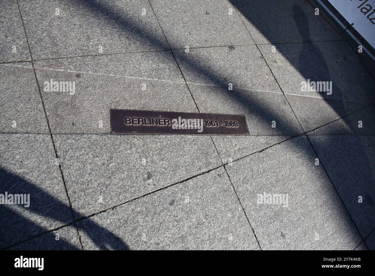 Outlines on a sidewalk in Potsdamer Platz & a sign showing where the ...