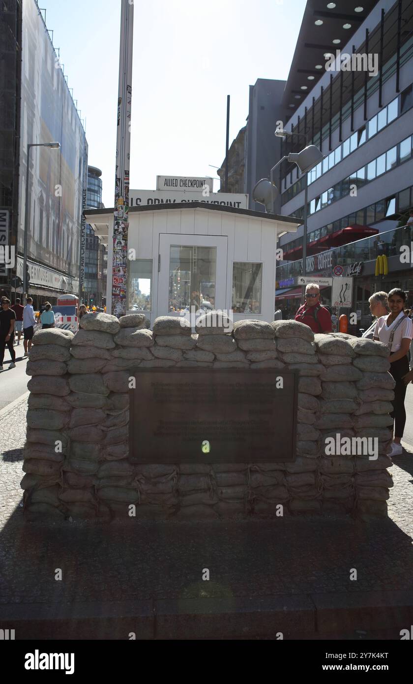 Shot against the sun, flare, tourists, booth & sandbags, remnant of ...