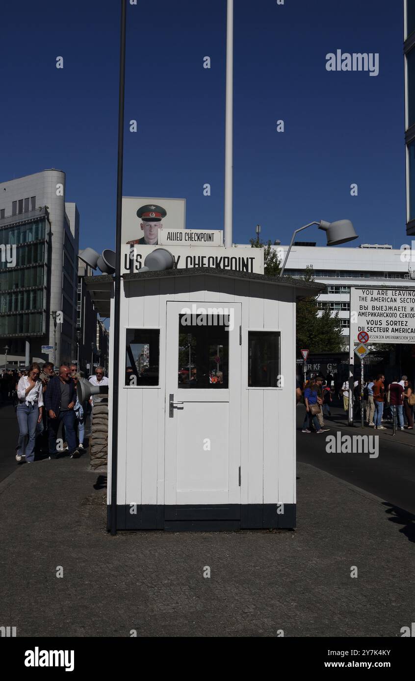 Tourists at a booth and sandbags, a remnant of Checkpoint Charlie on ...