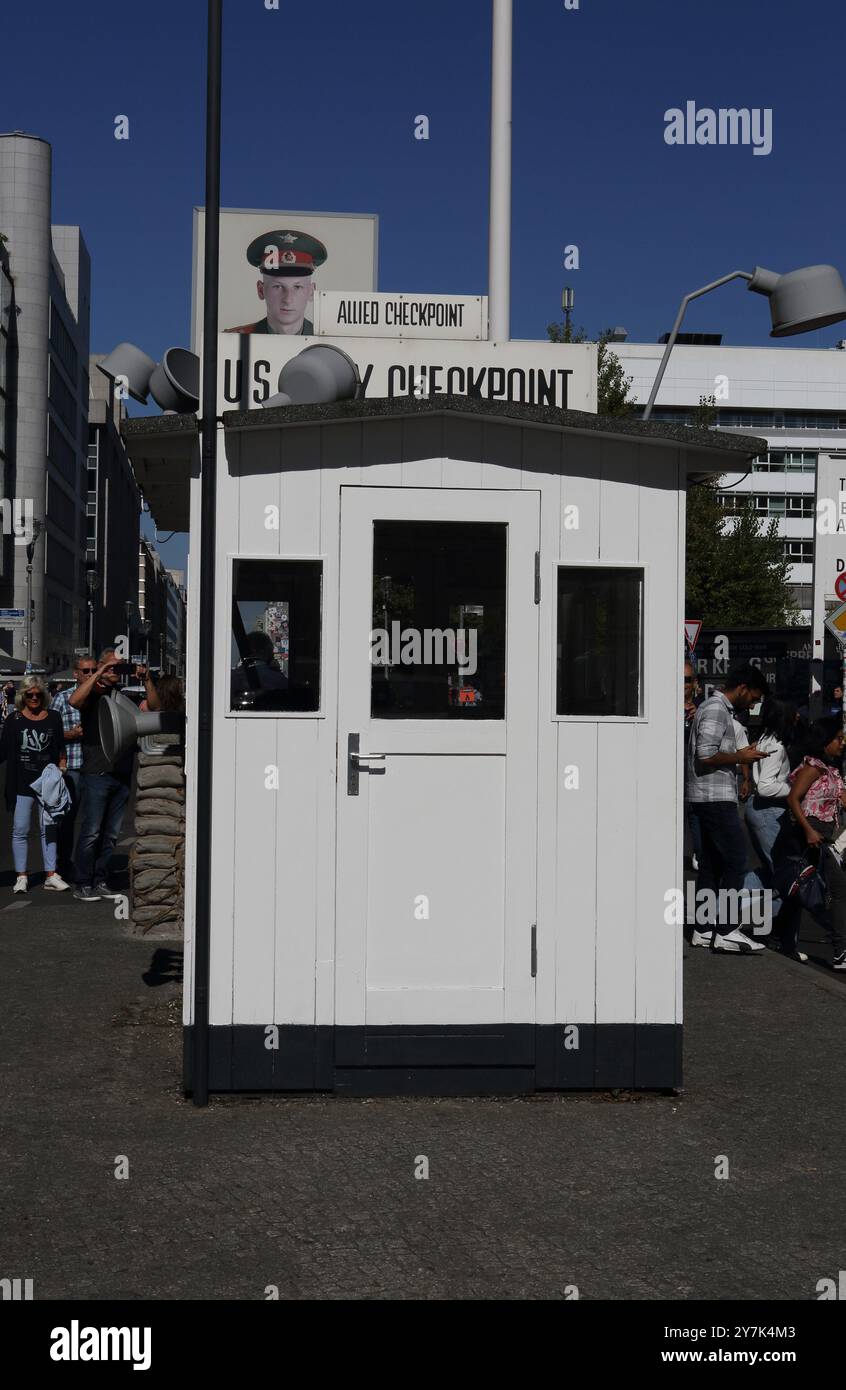 Tourists at a booth and sandbags, a remnant of Checkpoint Charlie on ...