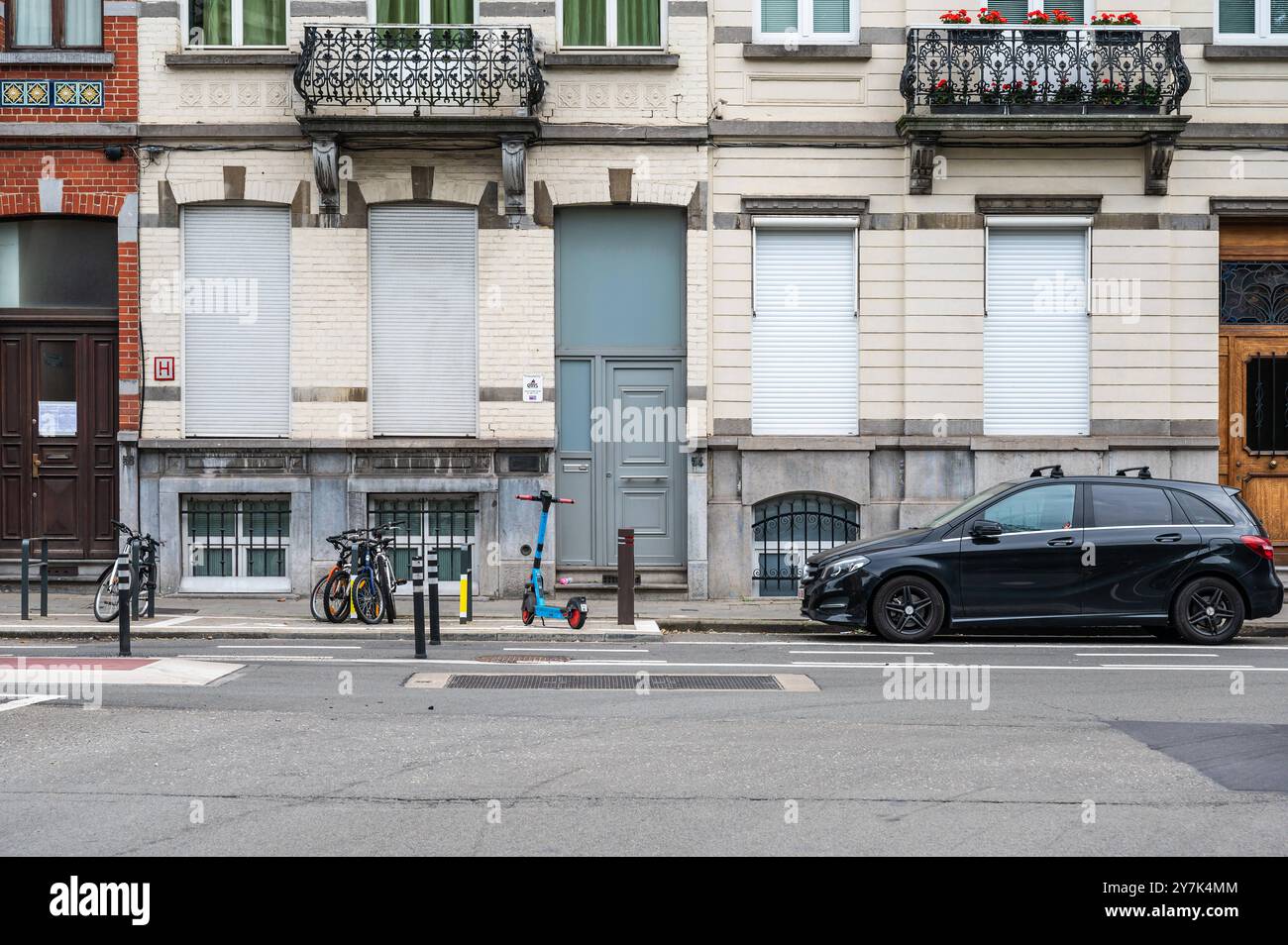 Facade of regular houses in a row in Jette, Brussels, Belgium, SEP 22 ...