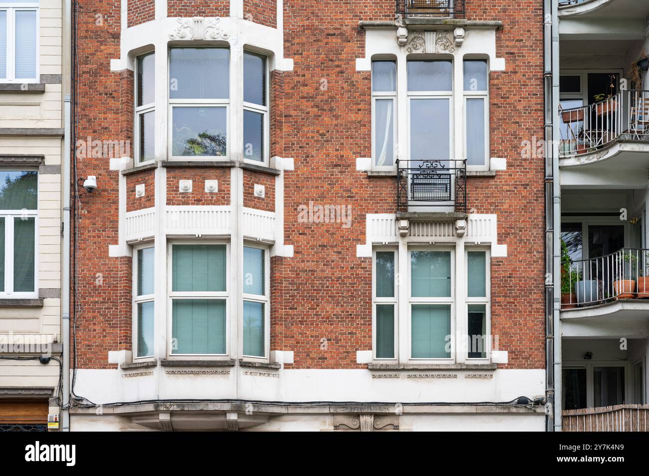 Facade of regular houses in a row in Jette, Brussels, Belgium, SEP 22 ...