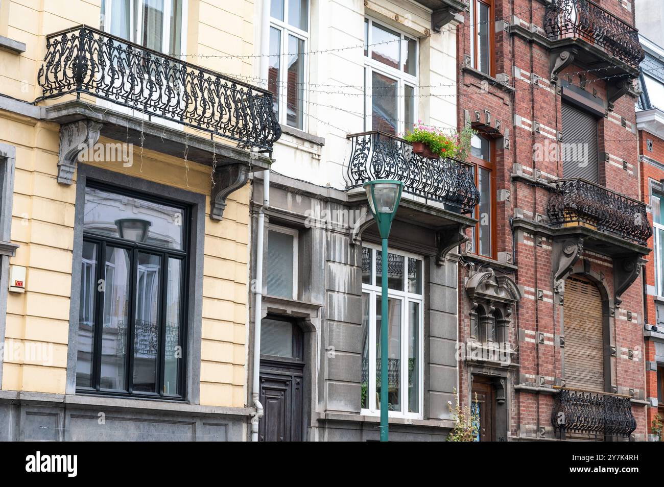 Facades of regular houses in a row in Molenbeek, Brussels, Belgium, SEP ...