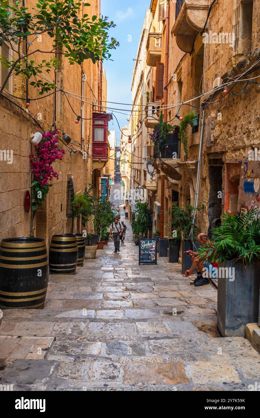 VALLETTA, MALTA - AUGUST 30 2024: Narrow street in Valletta with ...