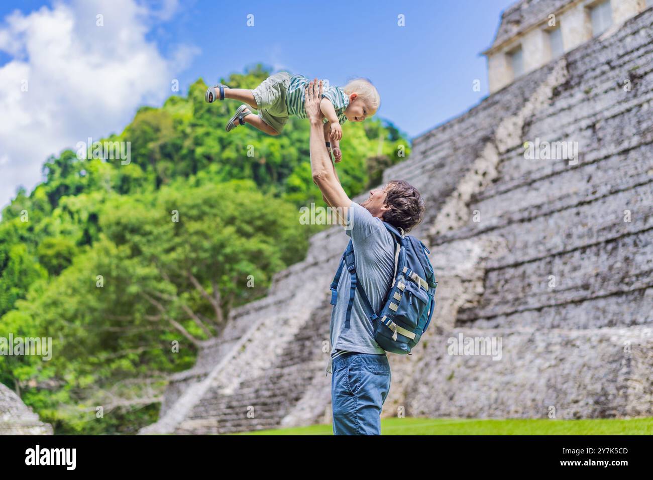 Father with his toddler son exploring the ancient pyramids of Palenque ...