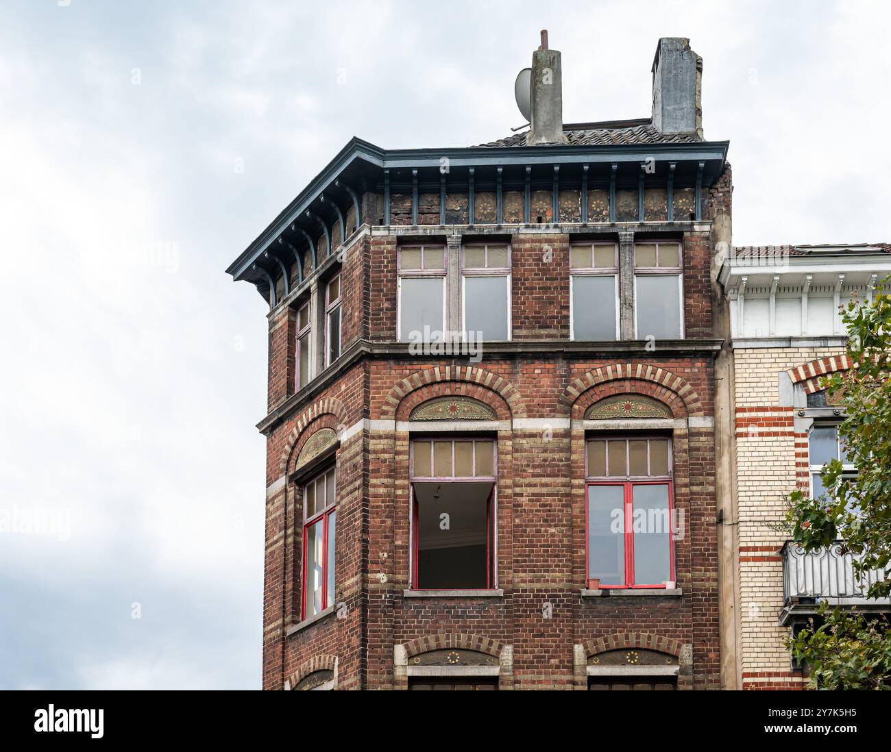 Facades of regular houses in a row in Molenbeek, Brussels, Belgium, SEP ...