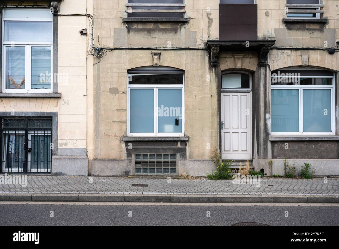Facades of residential houses in a row in Koekelberg, Brussels, Belgium ...
