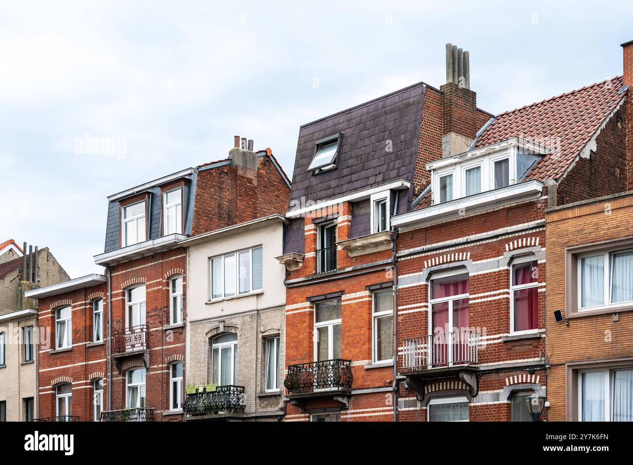 Facades of residential houses in a row in Koekelberg, Brussels, Belgium ...